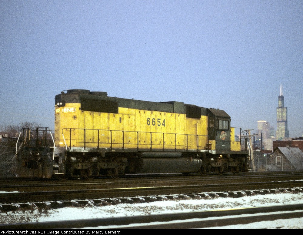 C&NW 6654 in Potato Yard with Sears Tower to the Right